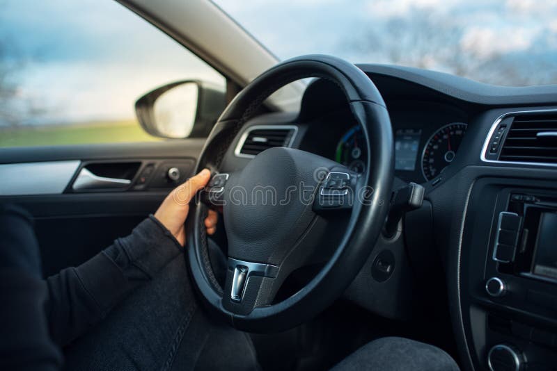 Close-up of Young Driver Behind the Wheel. Stock Image - Image of black ...