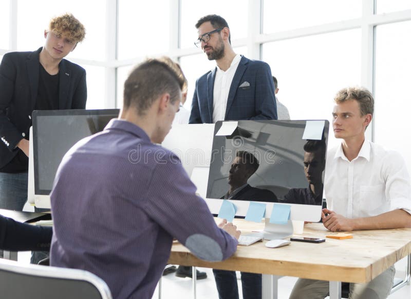 Close Up. Young Employees Discussing Working Documents Stock Photo ...