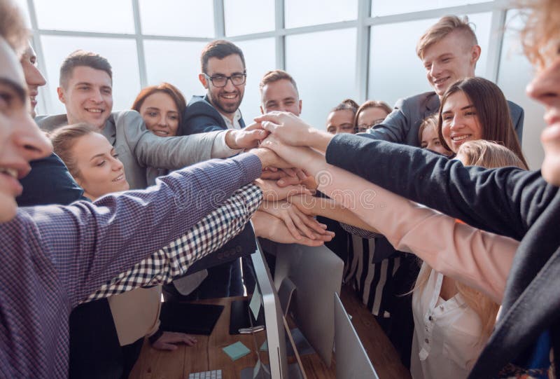 Close Up. Young Employees with a Gesture of Showing Their Unity Stock ...