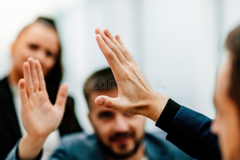Close Up. Young Employees Giving Each Other a High Five Stock Image ...