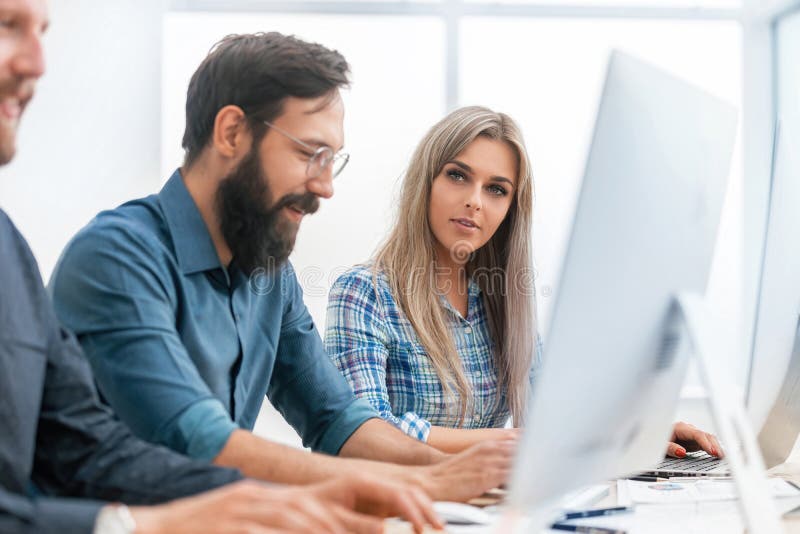 Close Up. Young Employees Work on Personal Office Computers Stock Photo ...