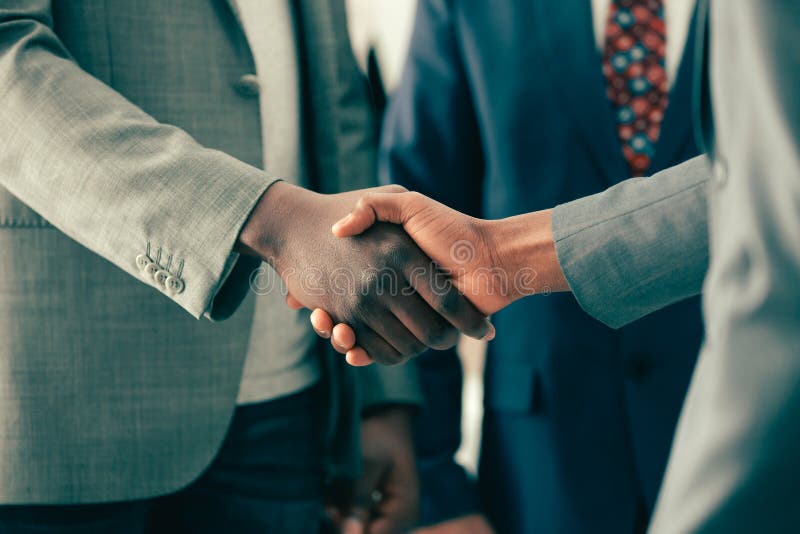 Young Entrepreneurs Shaking Hands in the Office Stock Photo - Image of ...
