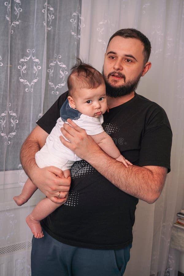 Close Up, a Young Father Holds His Newborn Son. Stock Photo - Image of ...