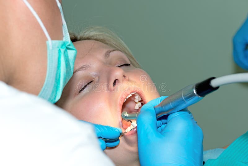 Close-up of Young Female Having Her Teeth Cleaned Stock Image - Image ...