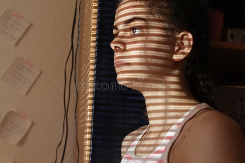 Close-up of a Young Girl`s Face Looking Out the Window Stock Image ...