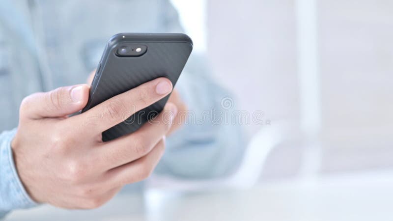 Close Up of Young Guy Hands Scrolling on Smartphone Stock Image - Image ...