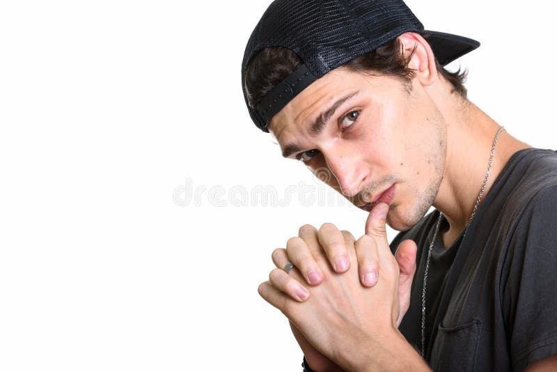 Close Up of Young Handsome Man Wearing Snapback while Intertwini Stock ...