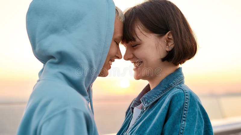 Full Length Shot Of Young Lesbian Couple Two Women Hugging And Kissing