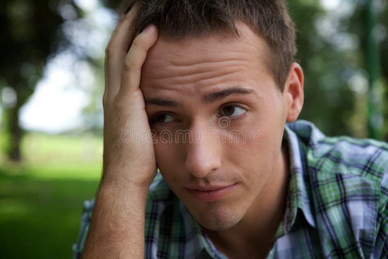 Young man contemplating stock photo. Image of front, serious - 53698266