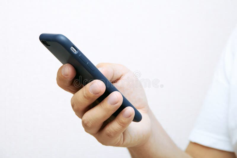 Close Up of a Man`s Hand Tapping on a Smartphone Screen with Icons of a ...
