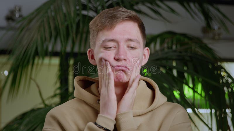 Close-up of a Young Man with Pimples on His Face. the Guy is Sad and ...