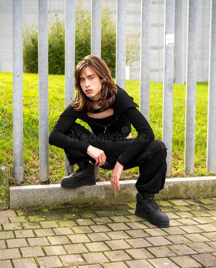 Close-up of Young Man Posing in a Crouch Looking Straight at the Camera ...