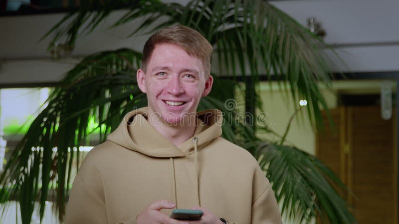 Close-up of a Young Man with Problematic Skin Typing a Message in His ...