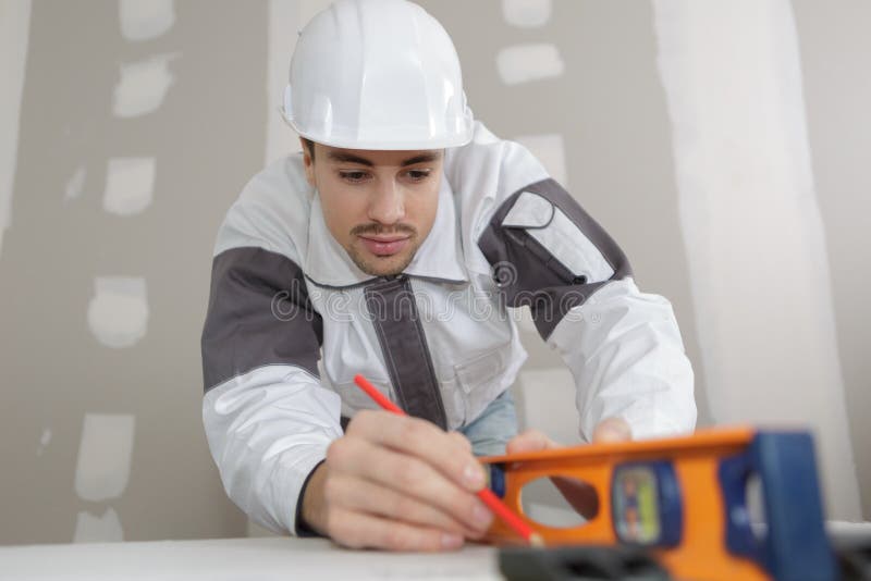 Close-up Young Man with Ruler Level Stock Image - Image of remodelling ...