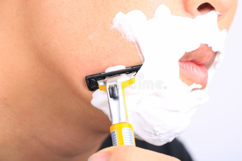 Close Up Young Man Shaving His Face. Stock Photo - Image of hand ...