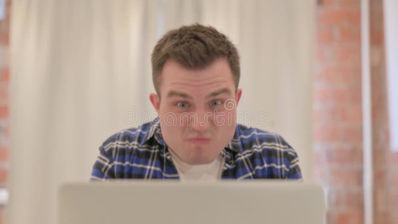Close Up of Young Man Shocked by Loss on Laptop Stock Video - Video of ...