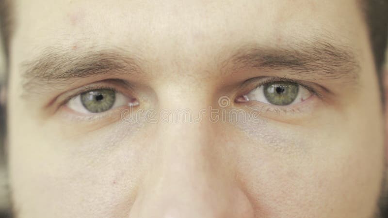 Close Up of Young Man Thinking about Something, Looking at Camera. Slow ...