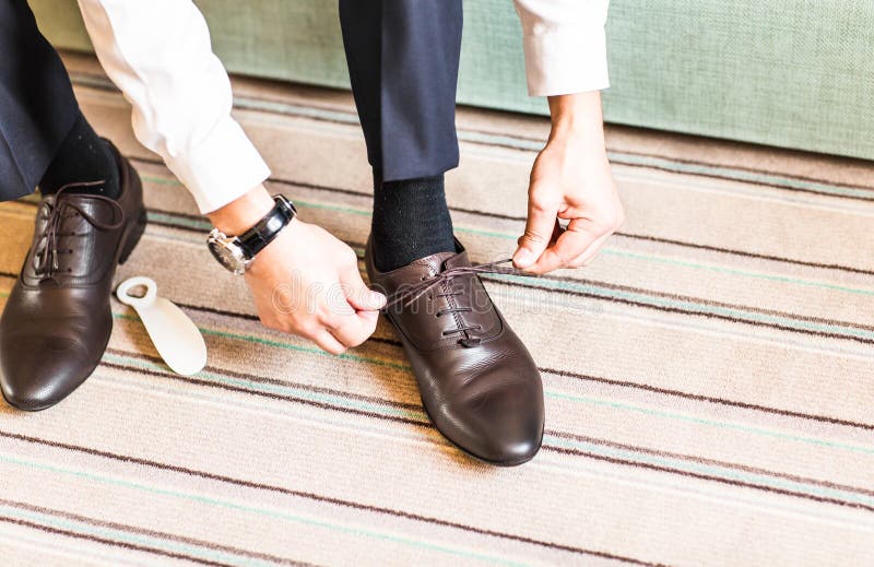 Close-up Young Man Tying Elegant Shoes Indoors Stock Photo - Image of ...