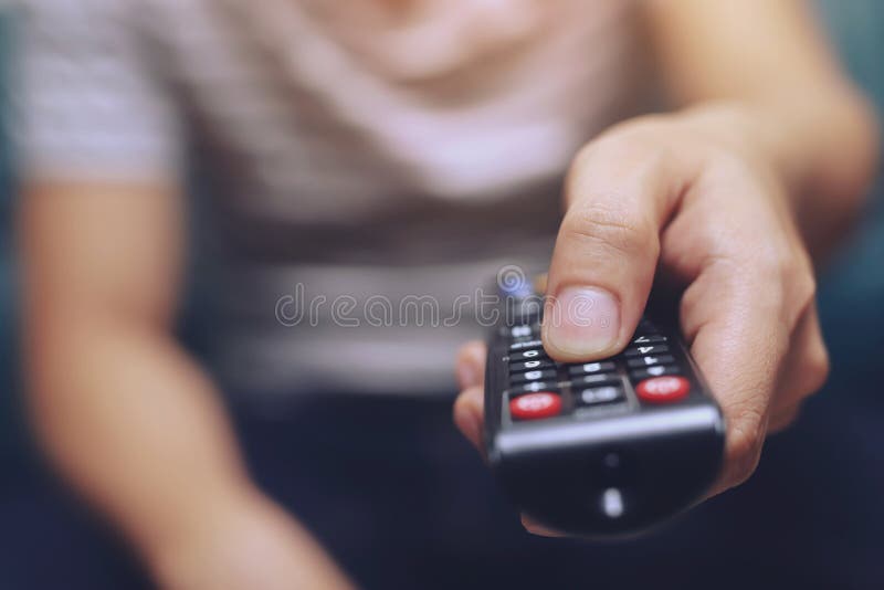 Close Up Television Remote Control in Casual Man Hands Pointing To Tv ...