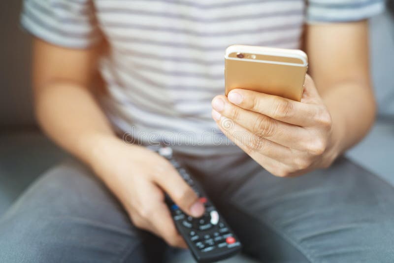 Close Up Television Remote Control in Casual Man Hands Pointing To Tv ...