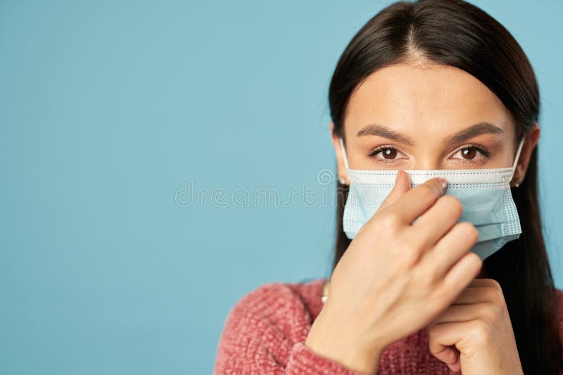 Young Woman Posing and Correcting Anti Virus Face Mask Stock Image ...