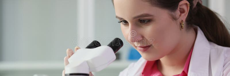 Woman Checks Result of Sample Examination Under Microscope Stock Photo ...