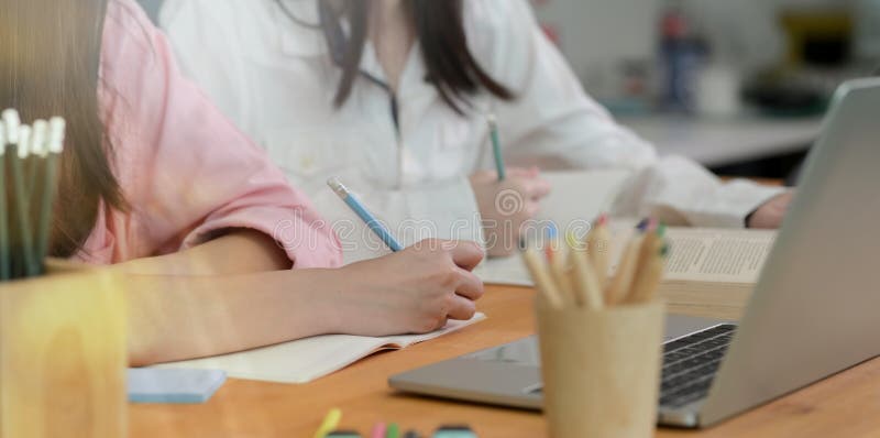 Close-up of Young Students Writing Their Homework Stock Image - Image ...