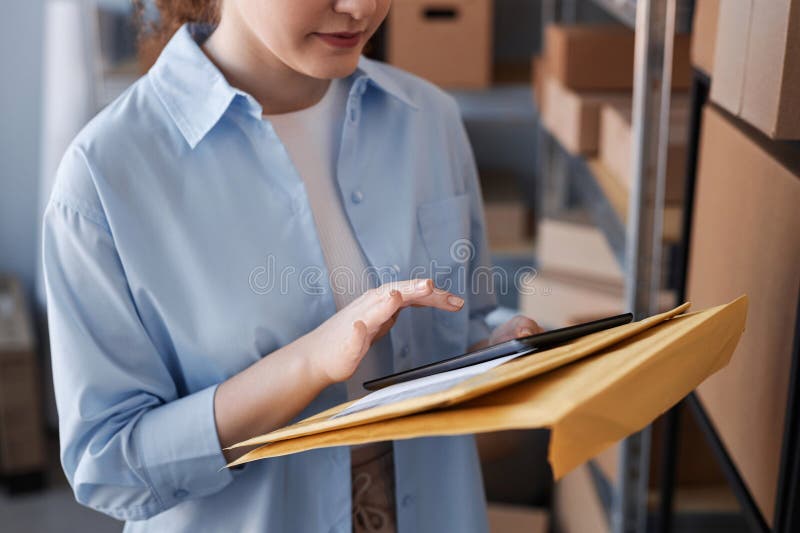 Close-up of Young Woman in Casualwear Using Tablet in Warehouse Stock ...
