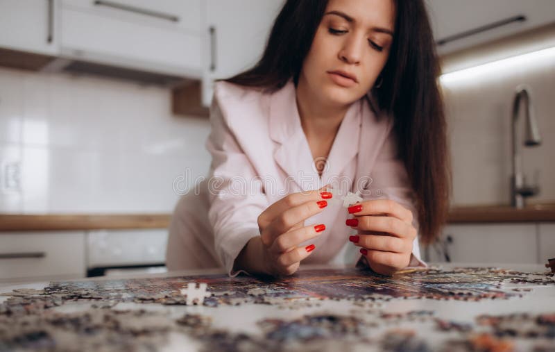 Close Up of Young Woman Doing Puzzle Stock Photo - Image of photograph ...