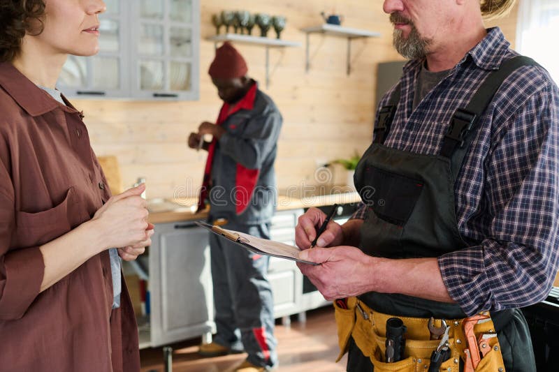 Close-up of Young Woman Explaining Technical Problem To Repairman Stock ...