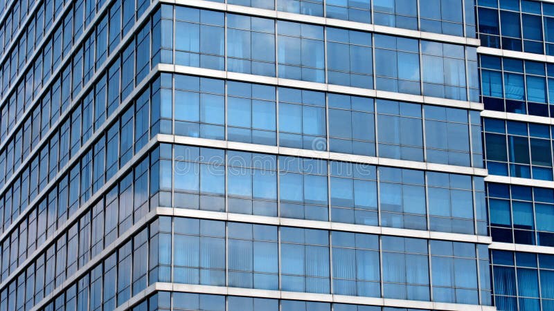 CLOSE VIEW of a BLUE GLASS WALLS and WHITE FRAMES BUILDING Stock Photo ...