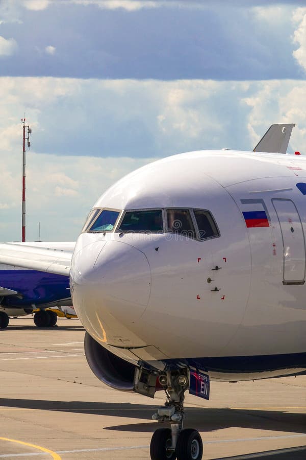 Close View of the Cockpit of a White Passenger Airplane Outside Stock ...