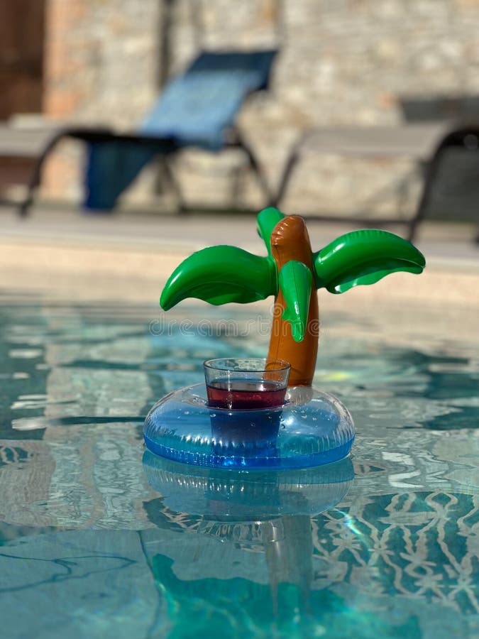 Close View of Funny Floating Drink in a Pool in the Shape of Palm Tree ...