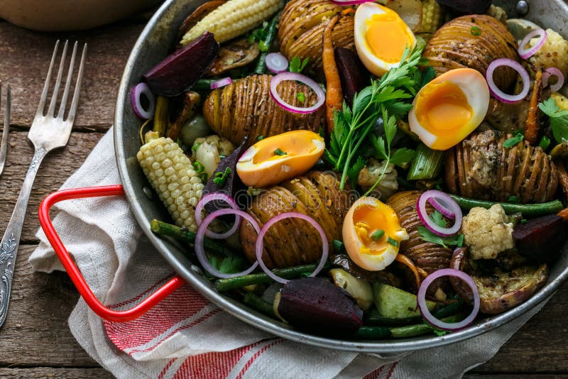 Close View of Hasselback Potatoes and Baked Vegetables Stock Photo ...