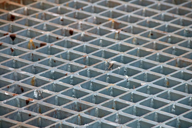 RECTANGULAR METAL GRID COVER OVER DRAIN in CONCRETE SURFACE Stock Image ...