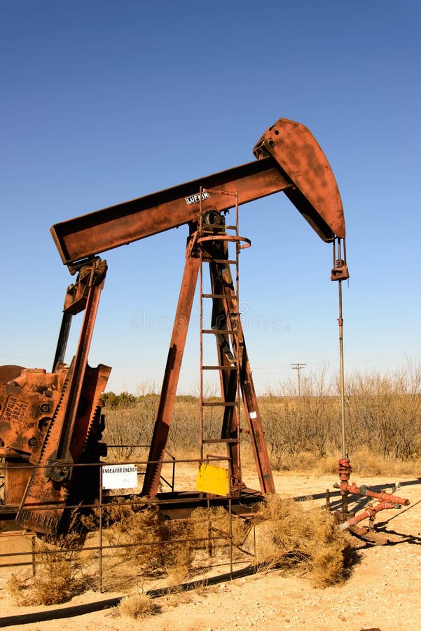 Old Rusty Oil Derrick in Sunlight with Blue Sky Editorial Photography ...