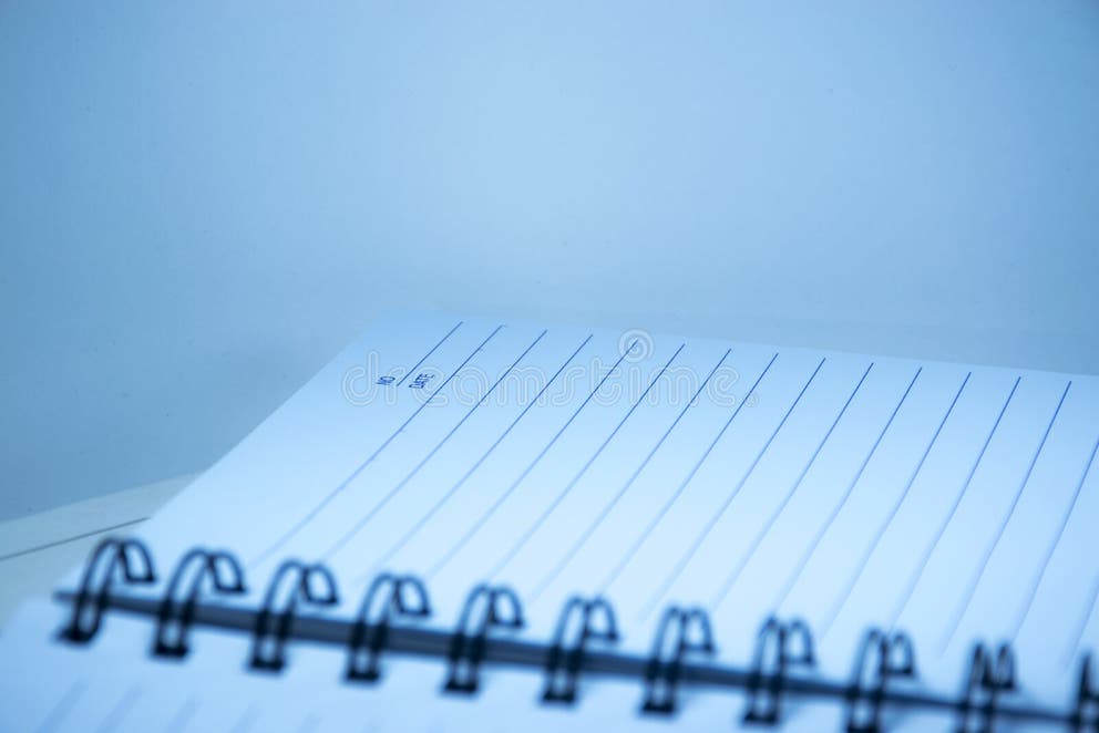 A Close View of an Open Diary or Notepad with Rings Isolated on a White ...