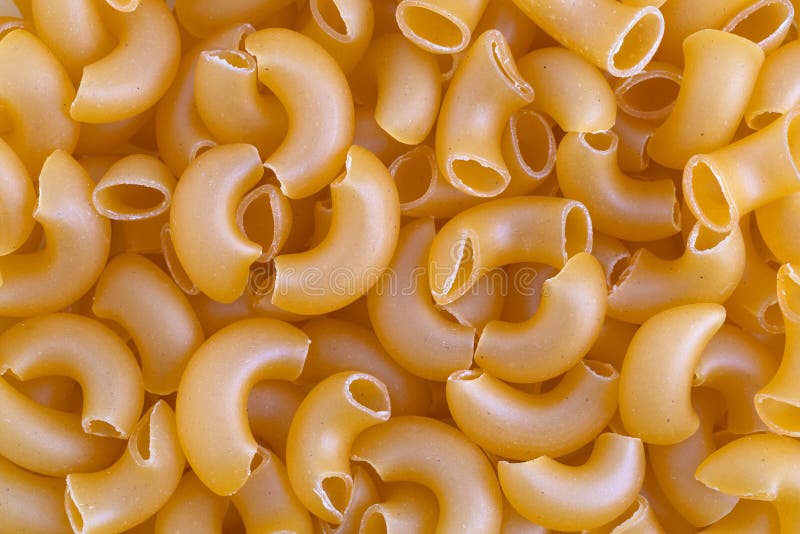 Organic Elbow Macaroni in a Glass Bowl Offset on a Gray Countertop ...