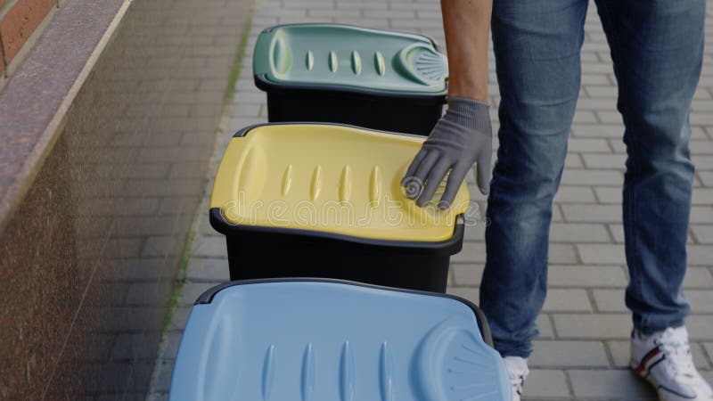 Close View of the Sorting Bin and the Male Hands in Gloves Puts Plastic ...