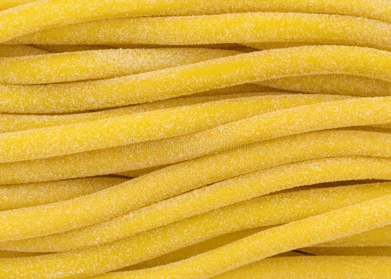 Sour Lemon Candy Sticks in Knots Filling a Wicker Basket Stock Image ...