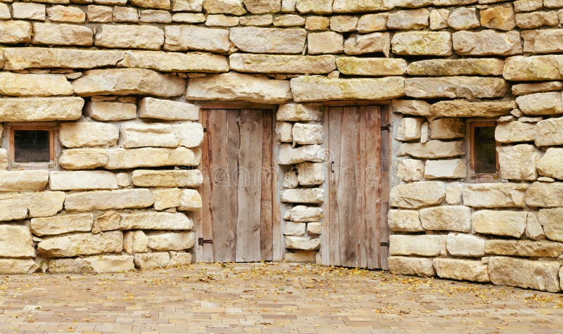 Closed Ancient Doors in Rough Stone Wall Stock Image - Image of ...