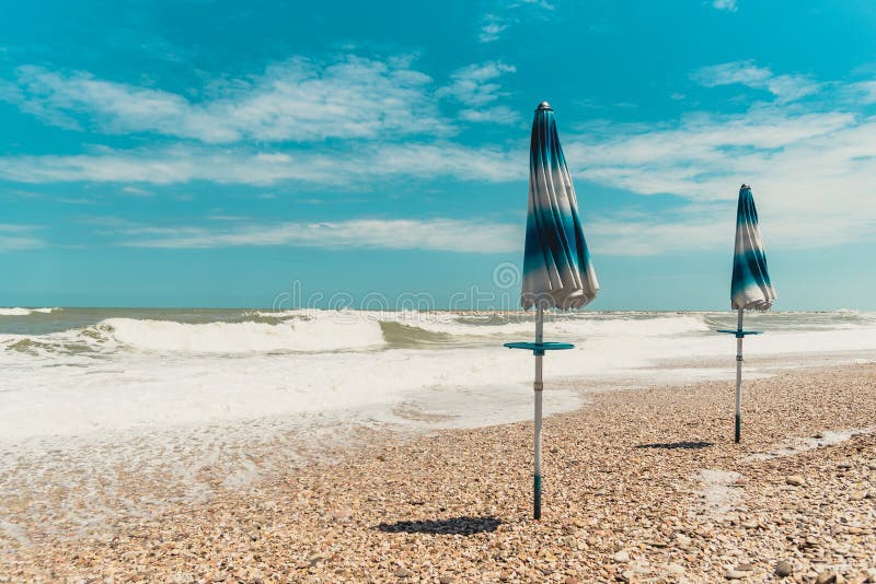 Closed Beach Umbrellas on a Beach on the Adriatic Sea in Italy Stock ...