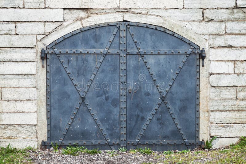 Closed Blue Metal Gate in Stone Wall Stock Image - Image of medieval ...