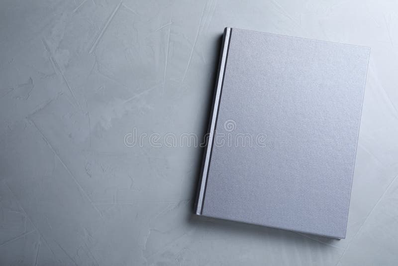 Closed Book with Hard Cover on Grey Table, Top View. Space for Text ...