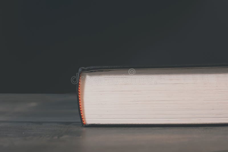 Closed book on the table stock image. Image of read - 260992141