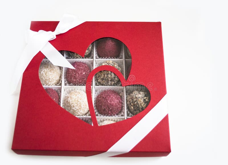 Closed box with Raffaello sweets, Closed red box with hearts and ...