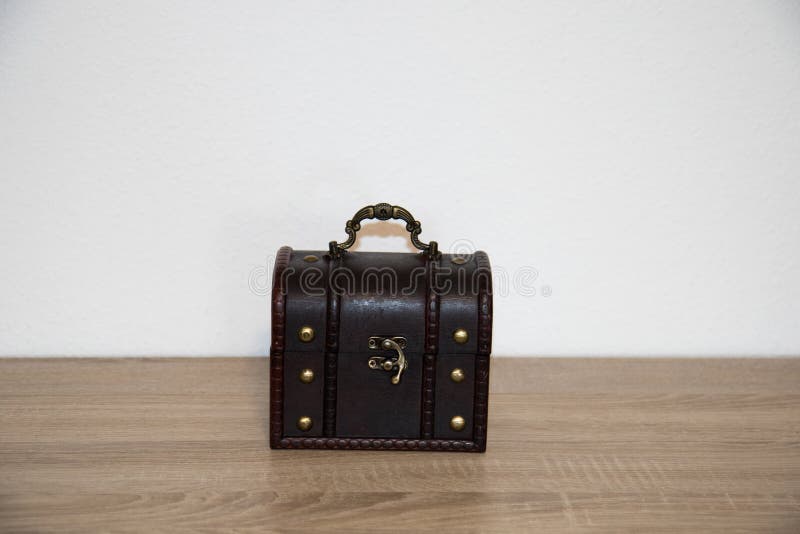 Closed Brown Treasure Chest on a Wooden Surface Stock Photo - Image of ...