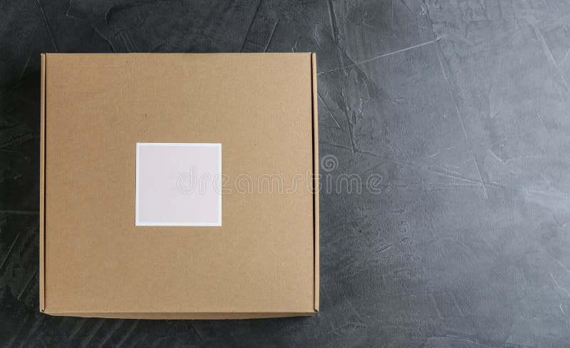 Closed Cardboard Box on Stone Table, Top View. Space for Text Stock ...