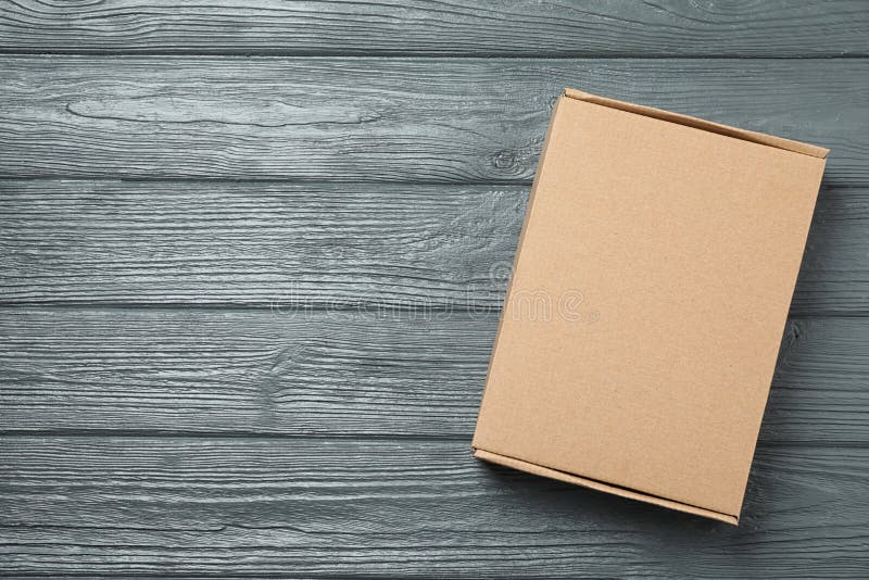 Closed Cardboard Box on Grey Wooden Table, Top . Space for Text Stock ...