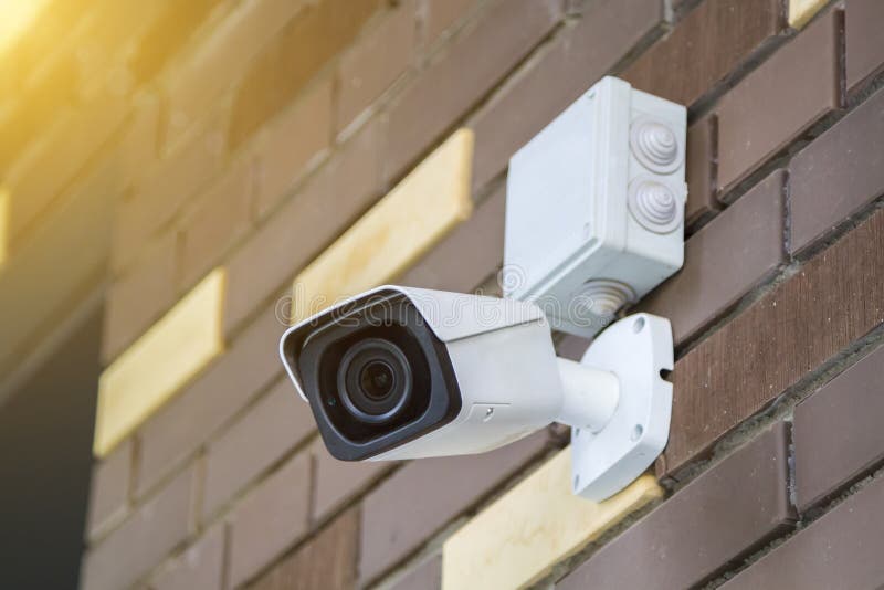 CCTV Security Camera on the Red Brick Stone Wall Stock Photo - Image of ...